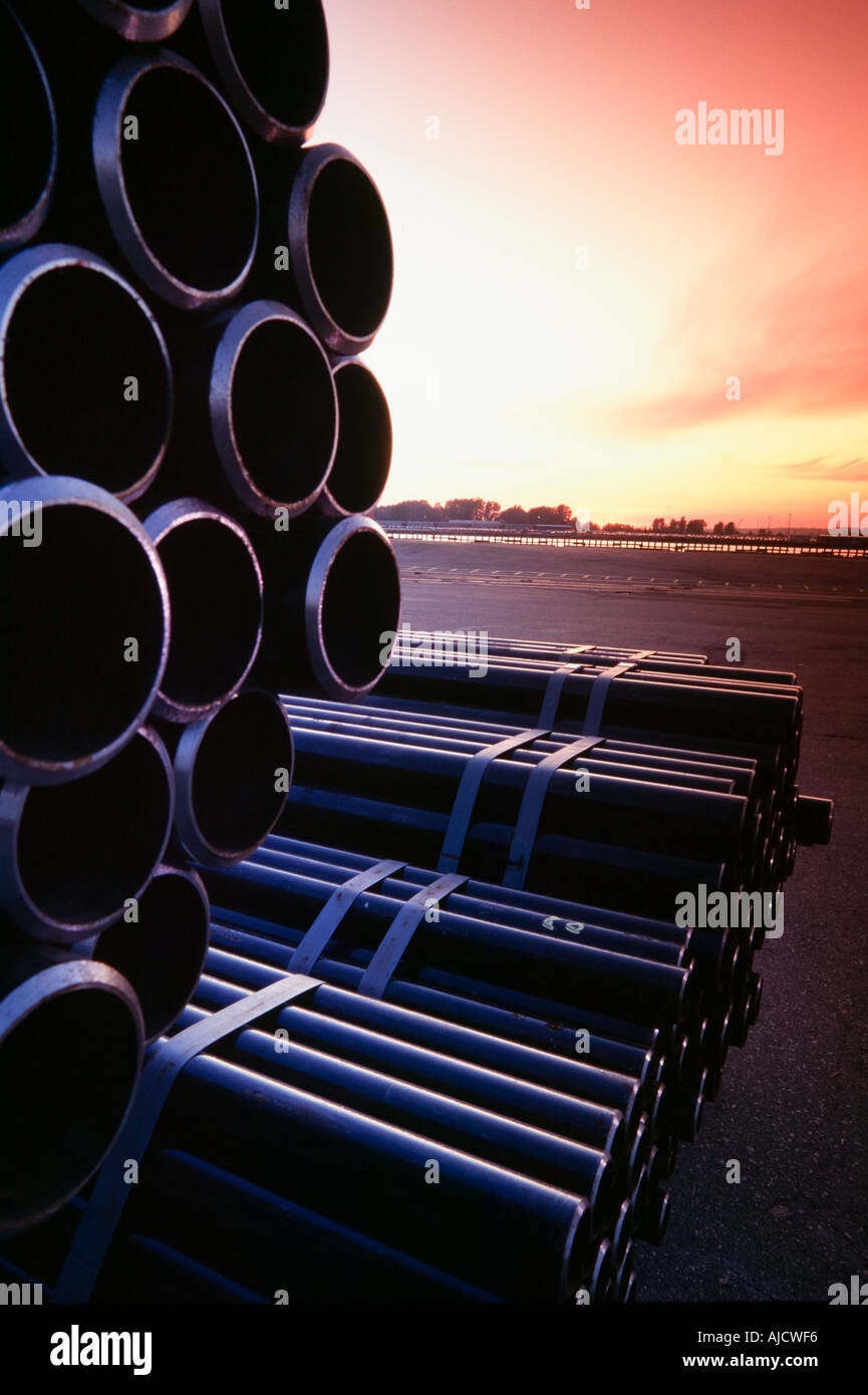 Steel pipes awaiting shipping at dock Stock Photo - Alamy