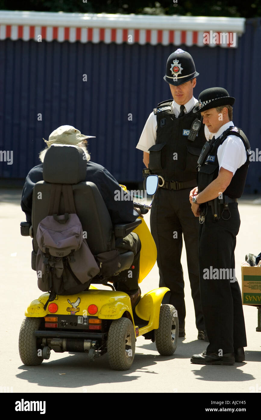 Police Officers in Woking Surrey talk to a disabled member of the ...