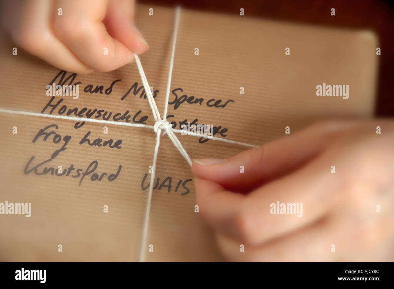 Wrapping a parcel Stock Photo - Alamy