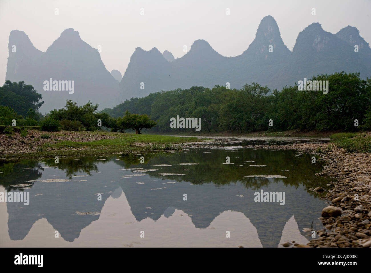 limestone peaks reflected in the Li River Guilin China Stock Photo - Alamy
