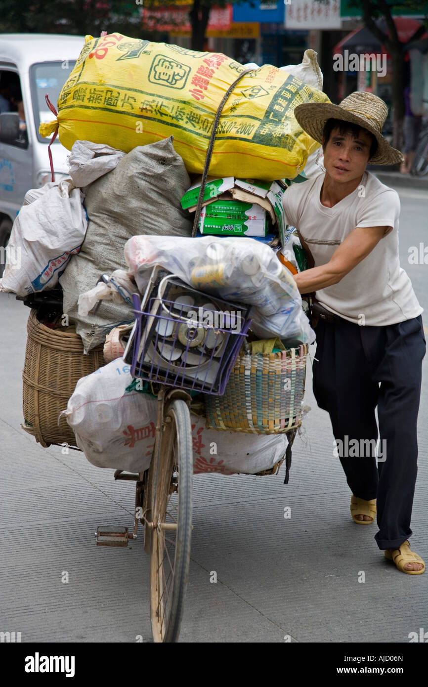 Man and his overloaded bicycle hi-res stock photography and images - Alamy