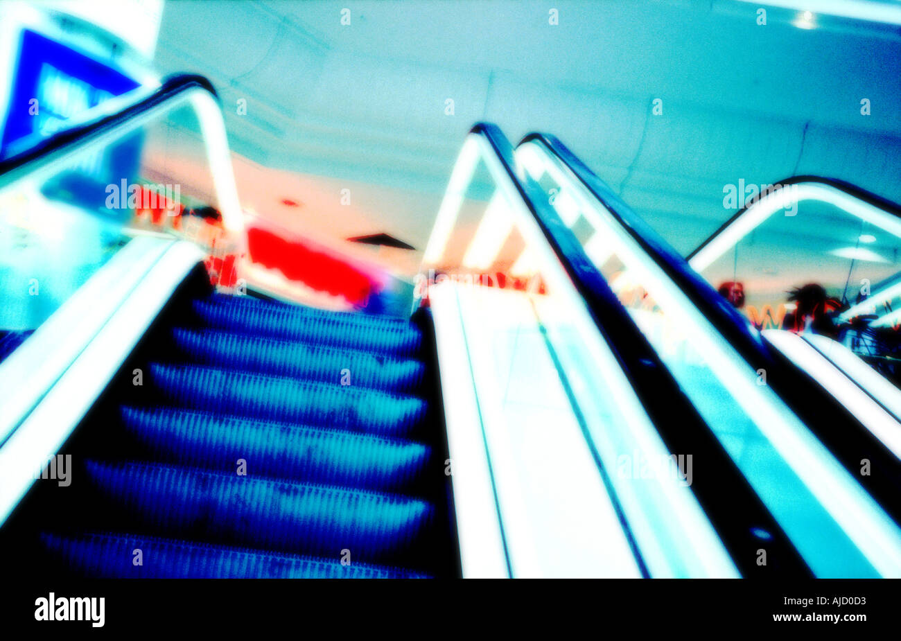 Close action photo with saturated colours and soft focus of escalator ...