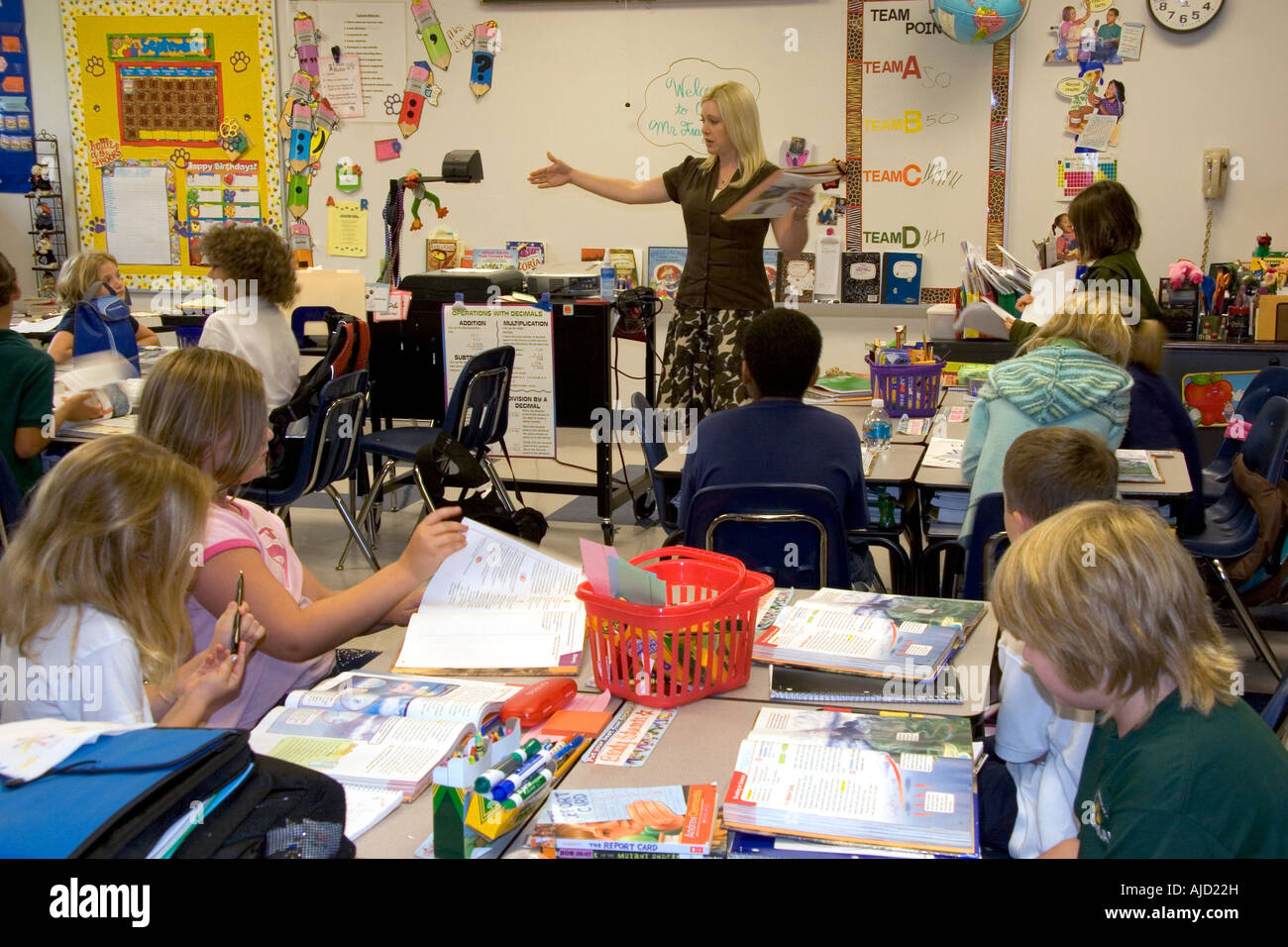 Fourth grade classroom with teacher and students at a public school in ...