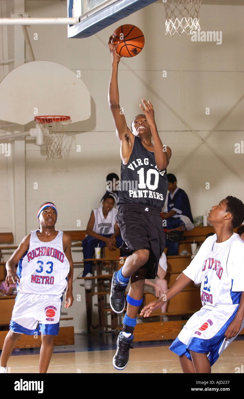 Boys basketball game action Stock Photo - Alamy