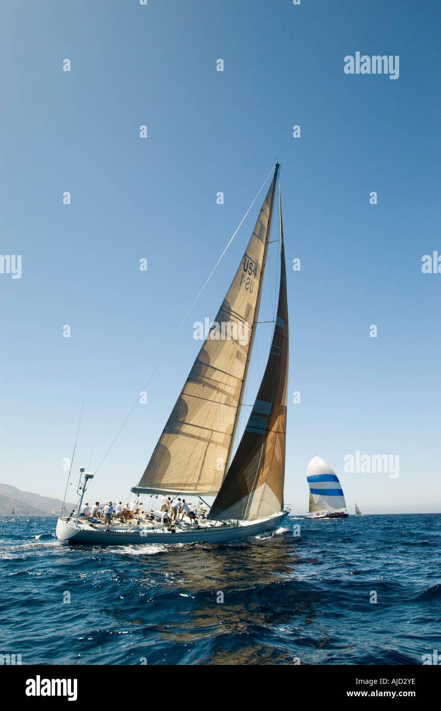 Sailboat in Race on ocean, back view Stock Photo - Alamy