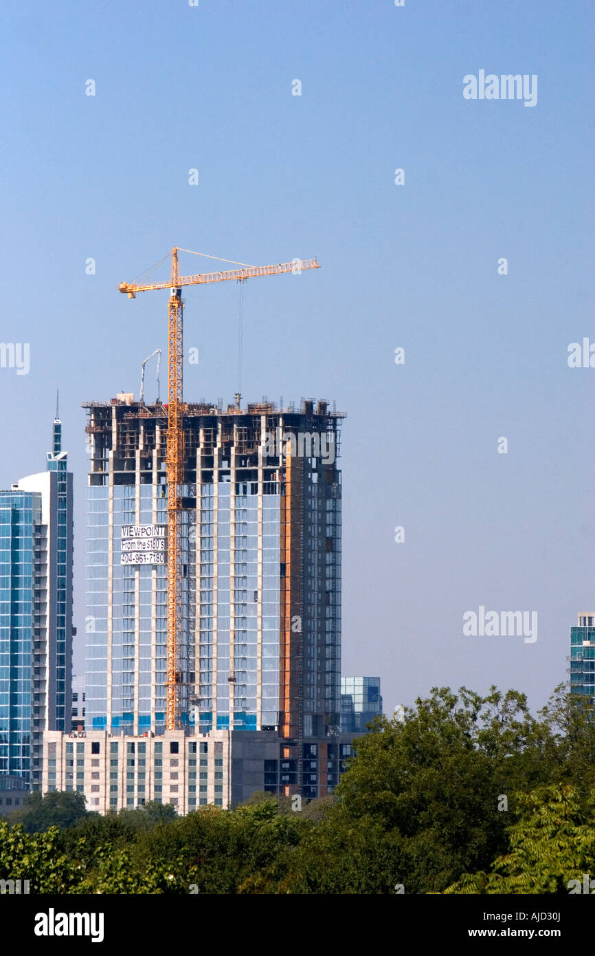 A large crane being used for construction of a new high rise building ...