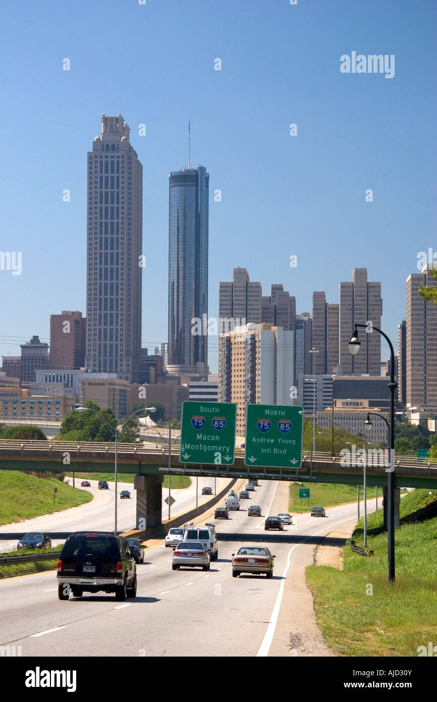 Automobiles travel on the interstate entering downtown Atlanta Georgia ...