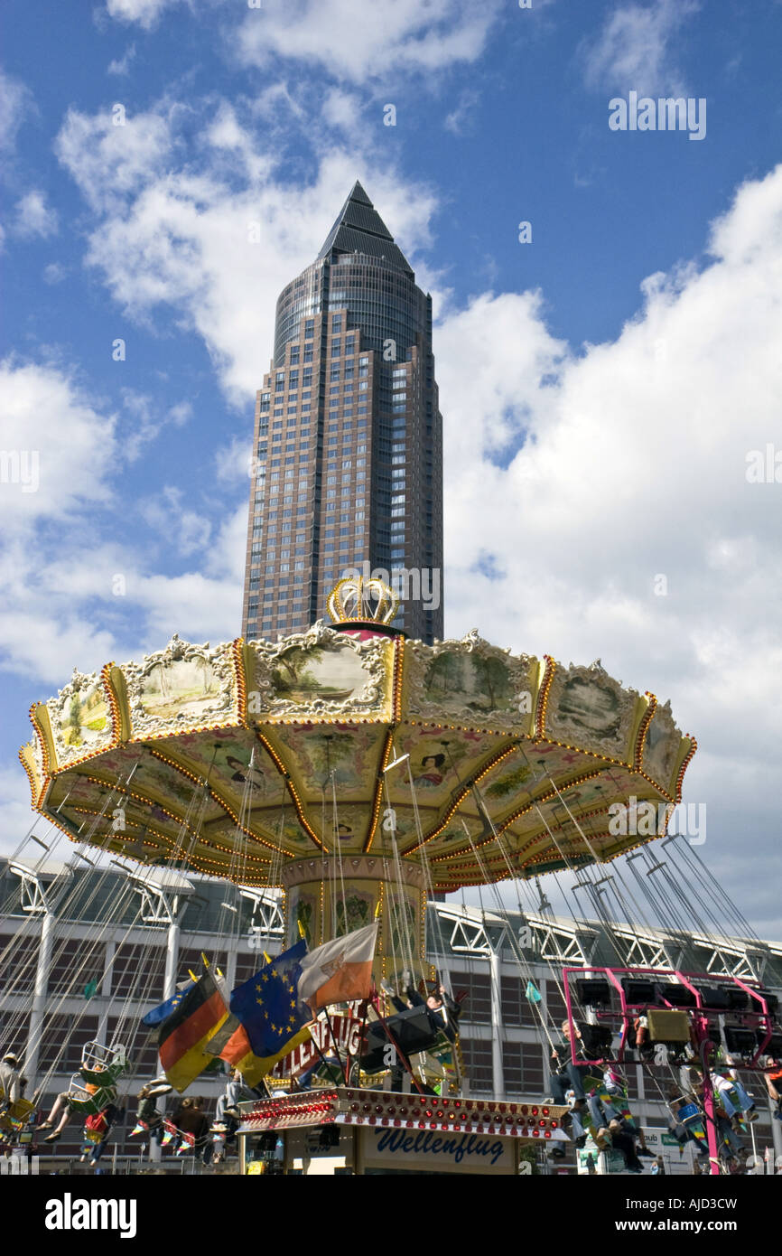 carousel in front of high-rise building, Messeturm 257 m, Germany ...