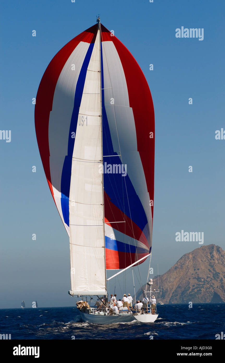Yacht on ocean with full sail, back view Stock Photo - Alamy