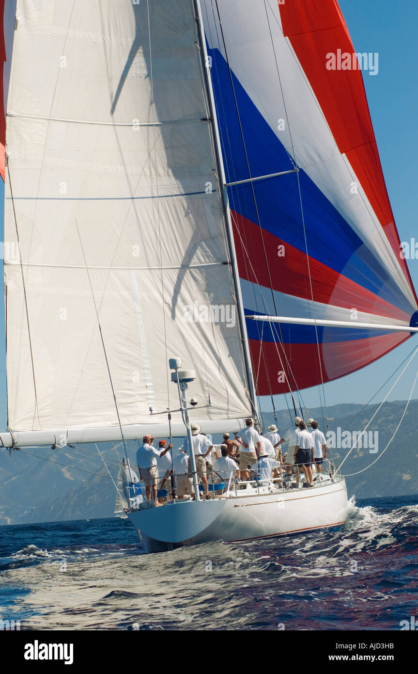 Yacht on ocean with full sail, back view Stock Photo - Alamy