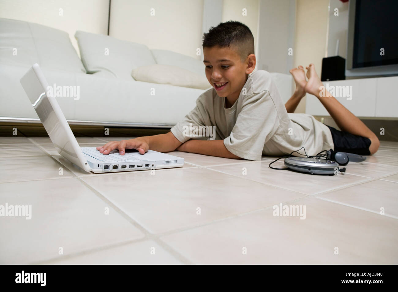 Barefoot boy with laptop hi-res stock photography and images - Alamy