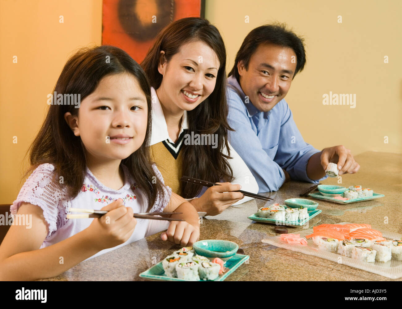 Black child eating sushi hi-res stock photography and images - Alamy