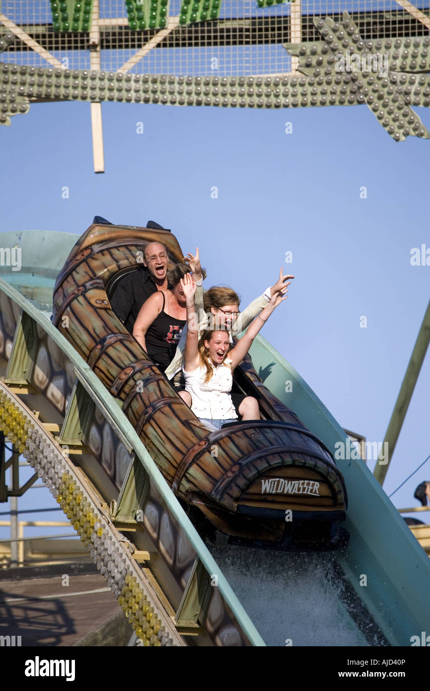 persons in a wild water slide on Cranger fair, Germany, Ruhr Area ...
