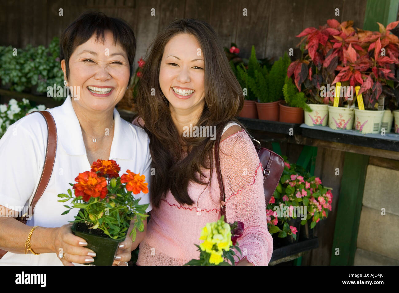 Portrait of young asian woman with flowers in her hair hi-res stock ...