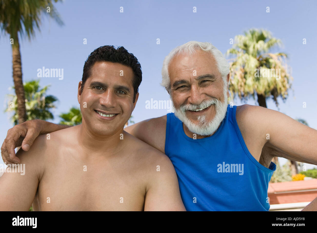 Senior Father and Son sitting outdoors, front view portrait Stock Photo ...