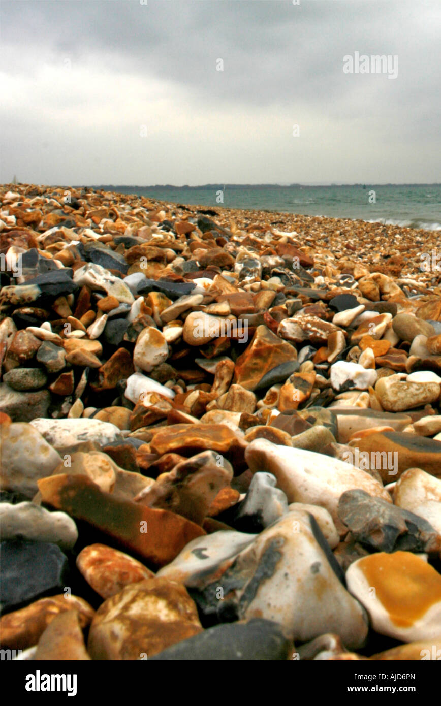 Pebbles on a beach spit at Calshot, near Southampton, Hampshire Stock ...
