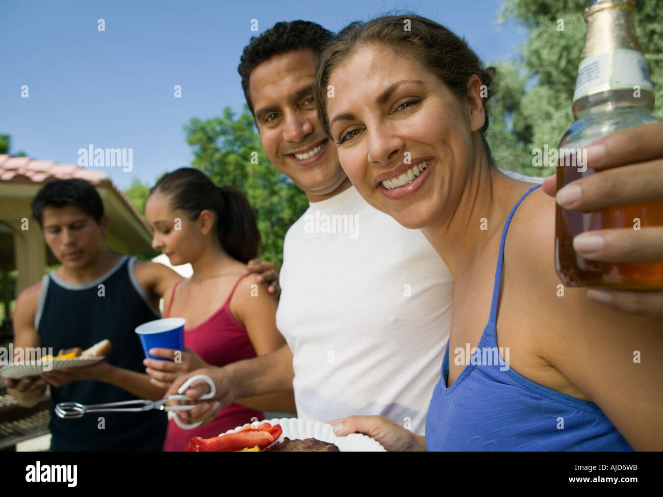 Two couples at outdoor picnic Stock Photo - Alamy