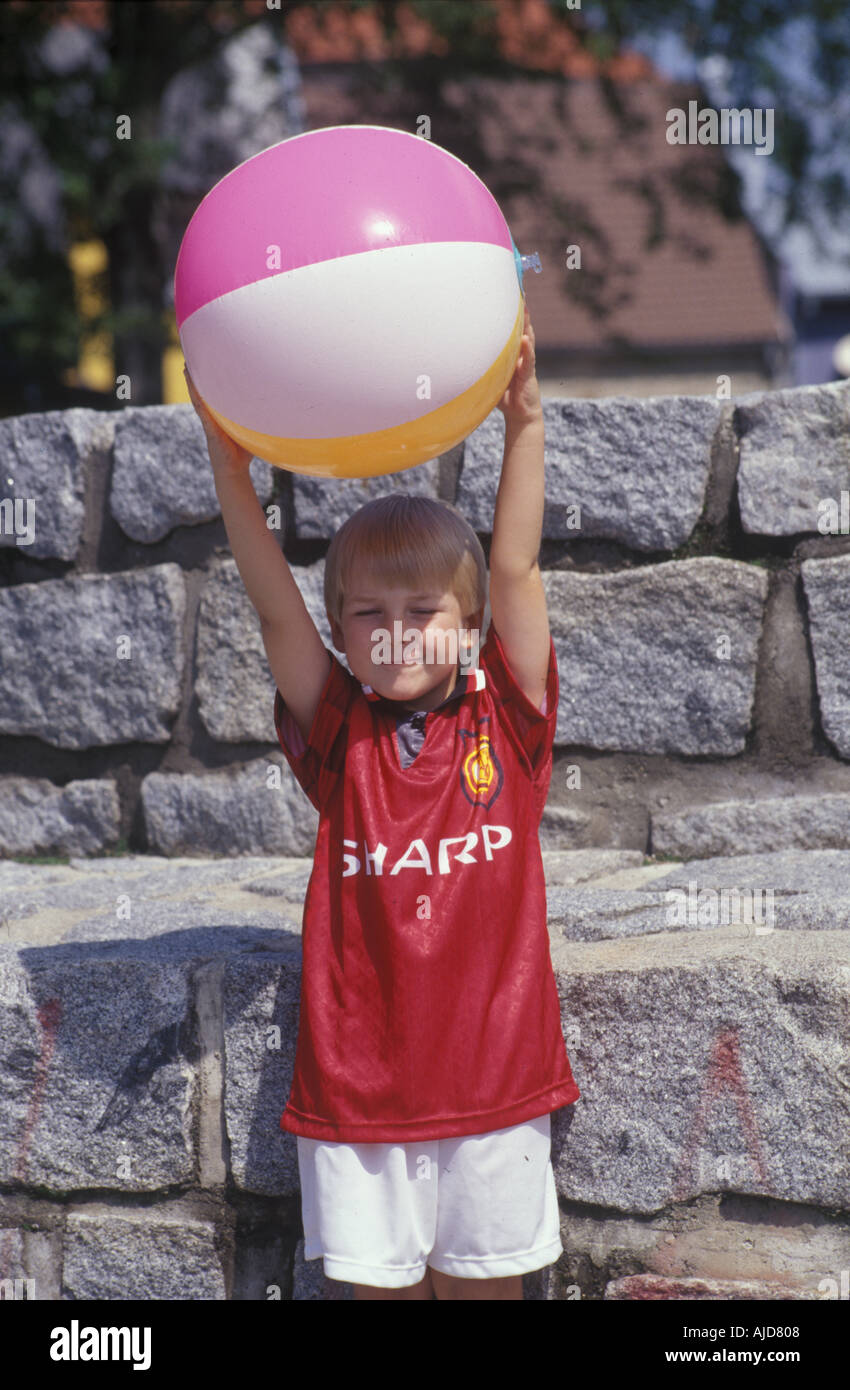 Boy lifting rock hi-res stock photography and images - Alamy