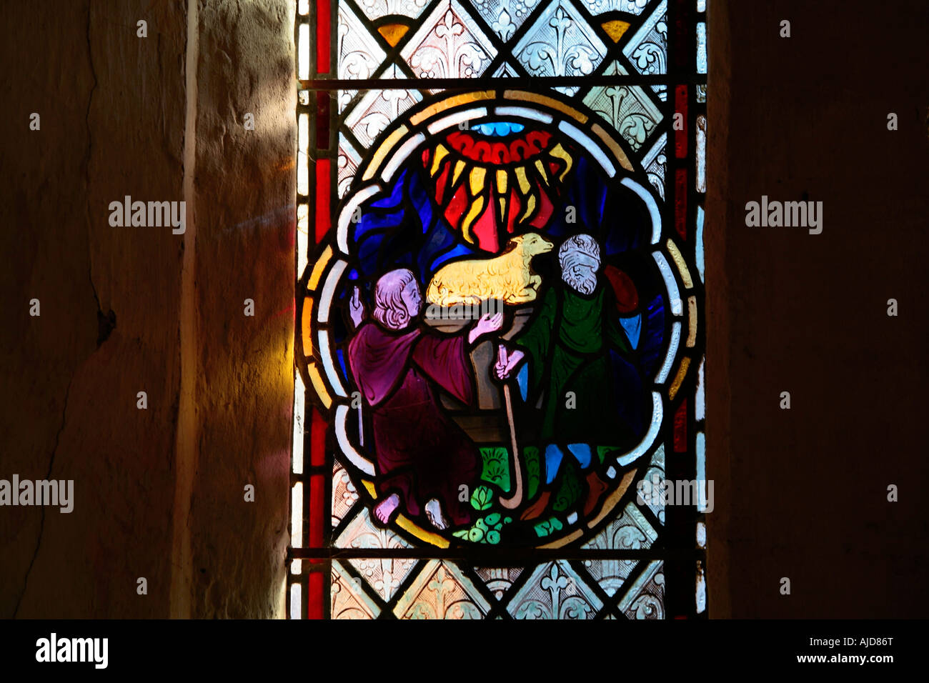 Stained glass window depicting the lamb of god hi-res stock photography ...