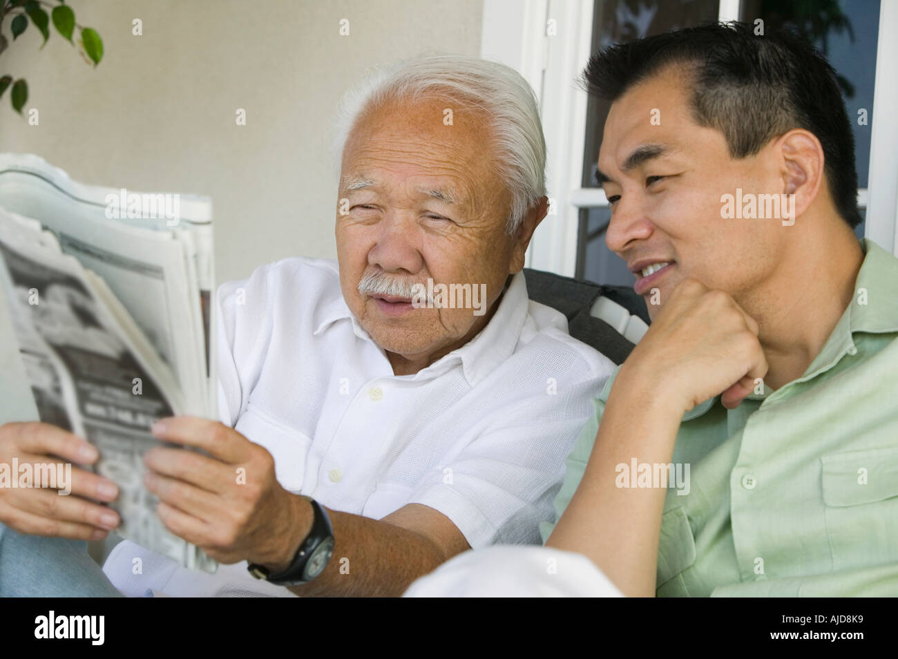 Father son reading newspaper hi-res stock photography and images - Alamy