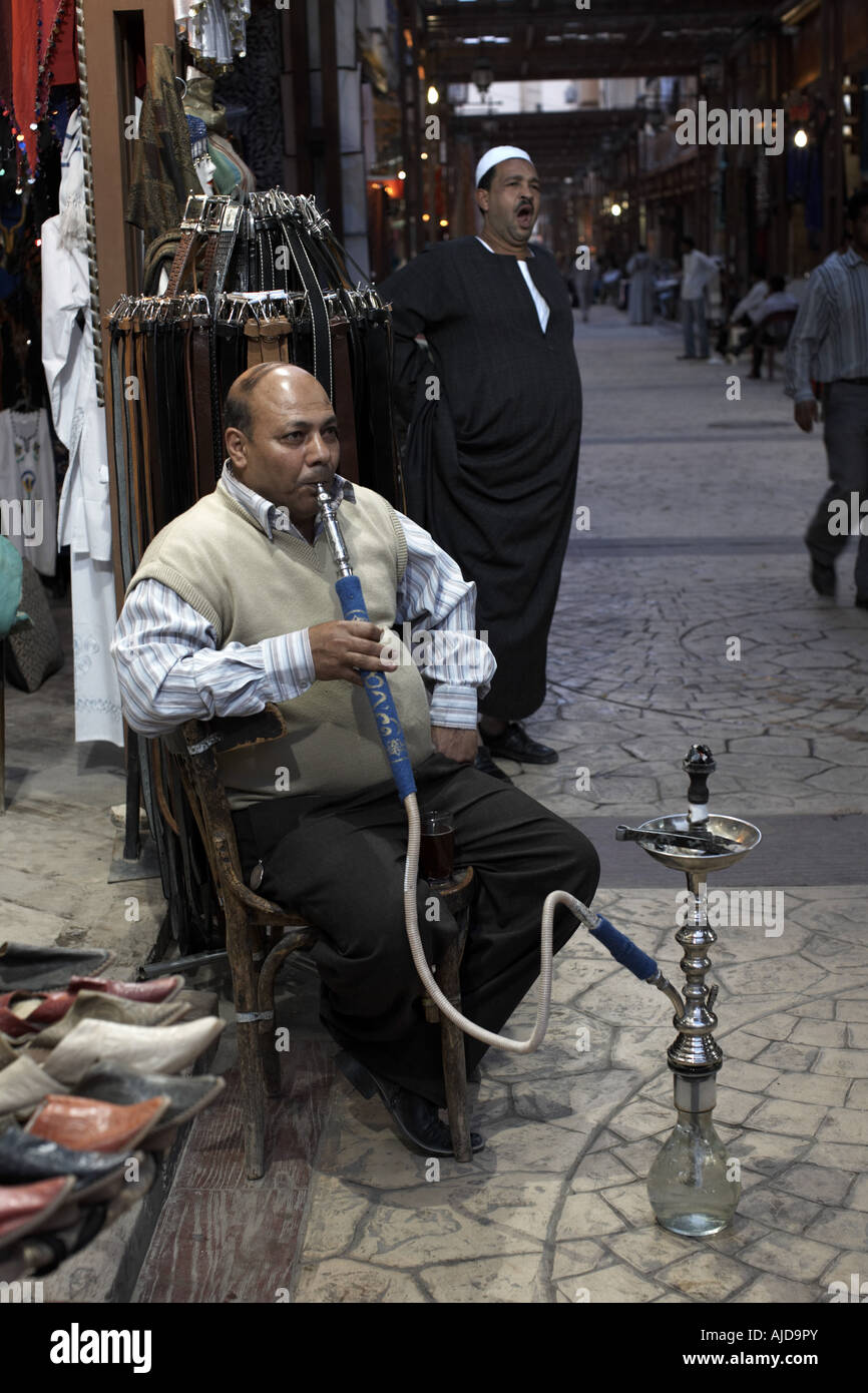 Man smoking Shisha in Luxor Stock Photo - Alamy