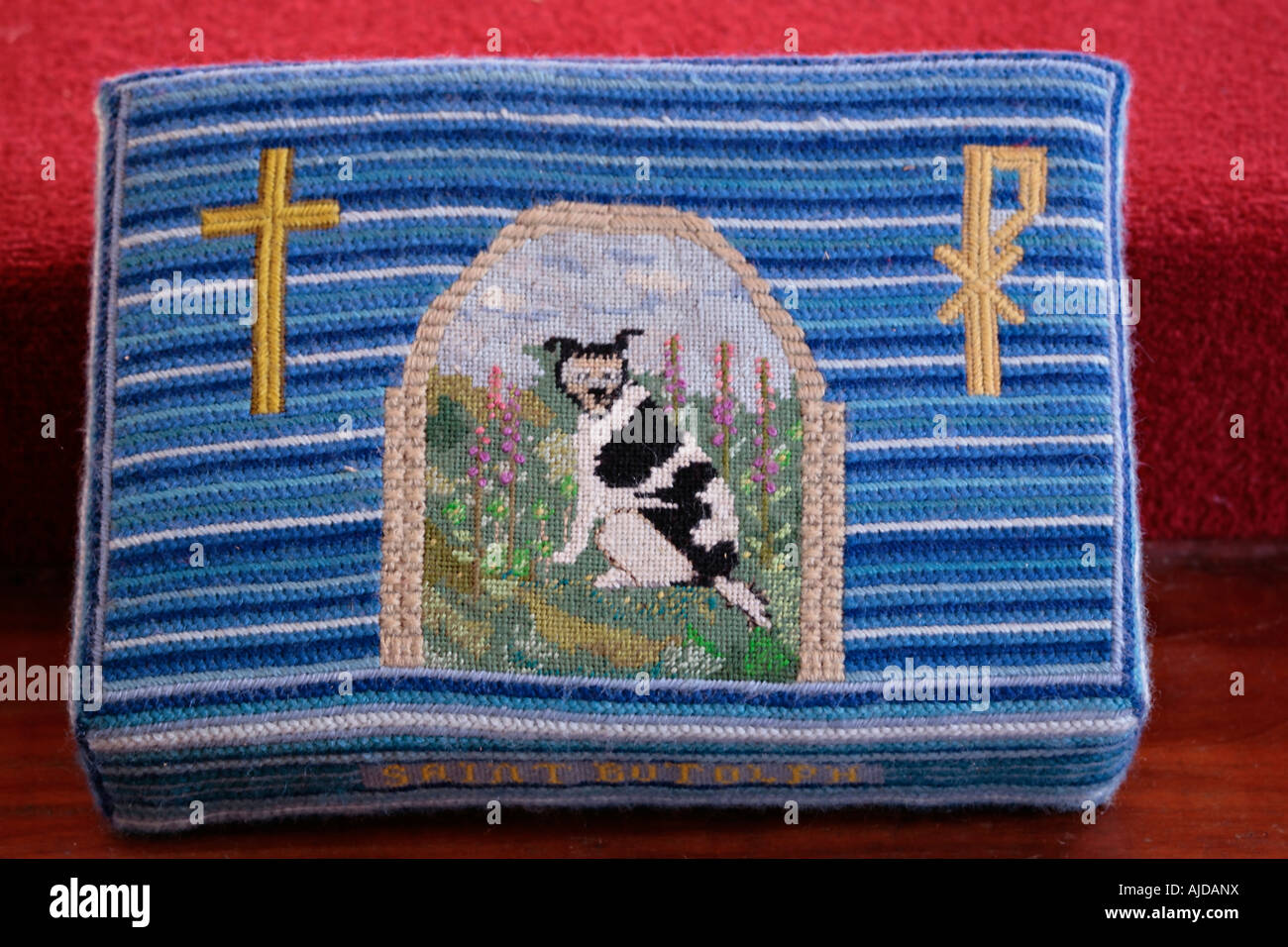 Church hassock embroidered with dog design Stock Photo - Alamy