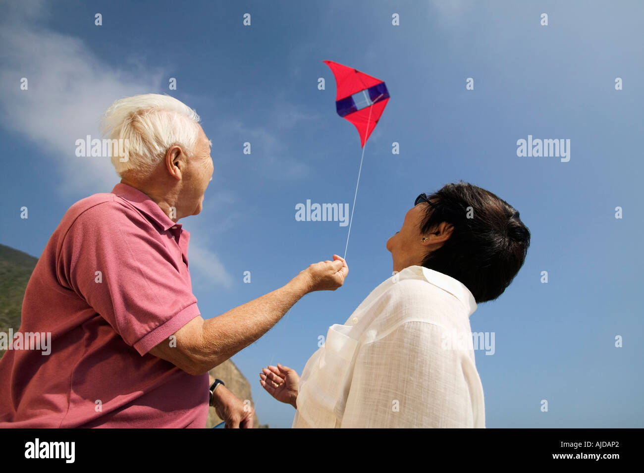 Mature women flying kite hi-res stock photography and images - Alamy