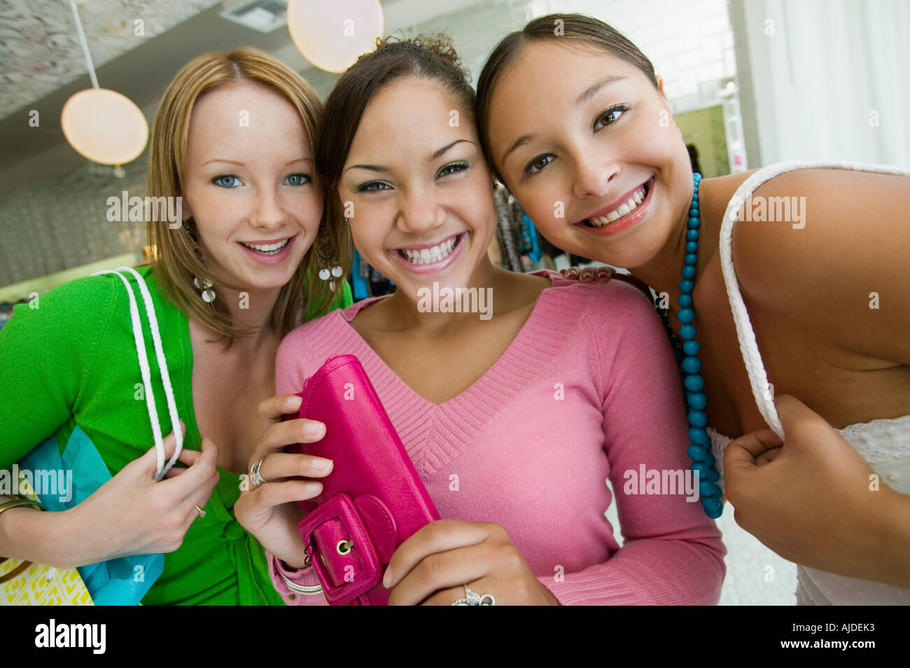 Three Girls Shopping at Boutique, portrait Stock Photo - Alamy