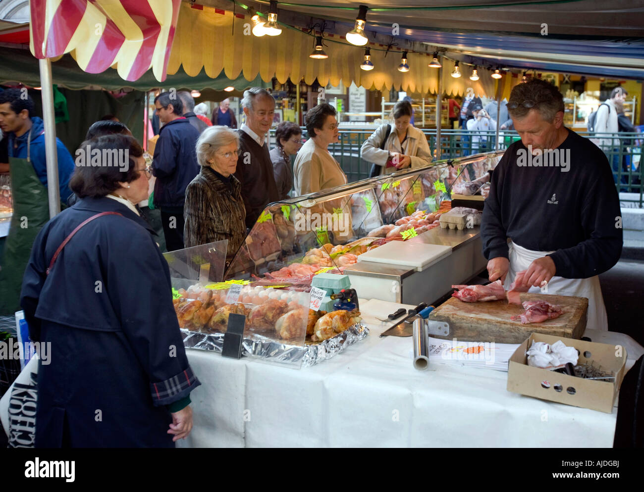 Butcher stall at Saint Germain outdoor market in Paris Stock Photo - Alamy