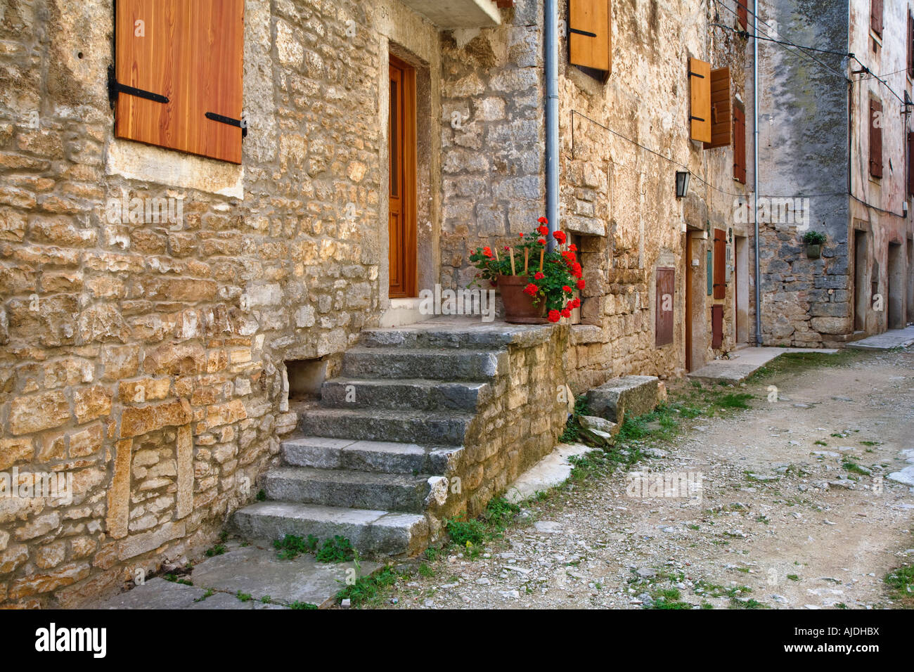 Flower pot sits on stone stairway in the village of Bale Croatia Stock ...