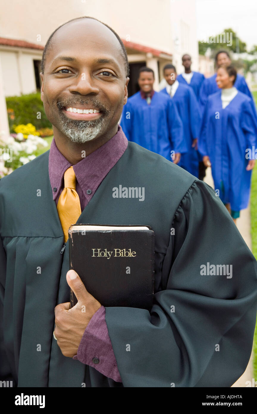 Smiling Preacher on garden path, portrait Stock Photo - Alamy