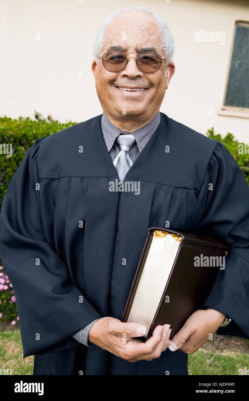 Smiling preacher bible in church hi-res stock photography and images ...