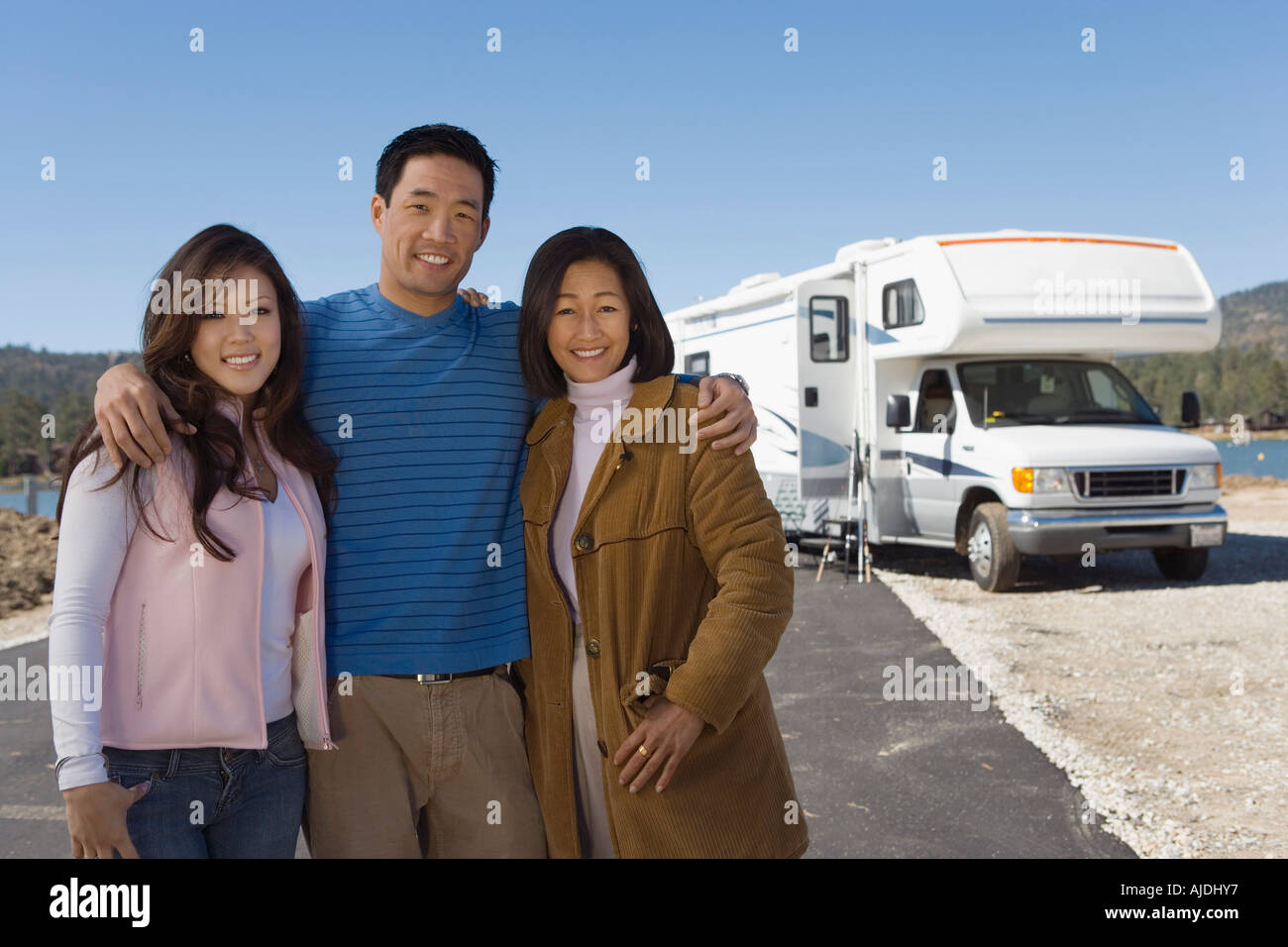 Family with teenage daughter outside of RV Stock Photo - Alamy