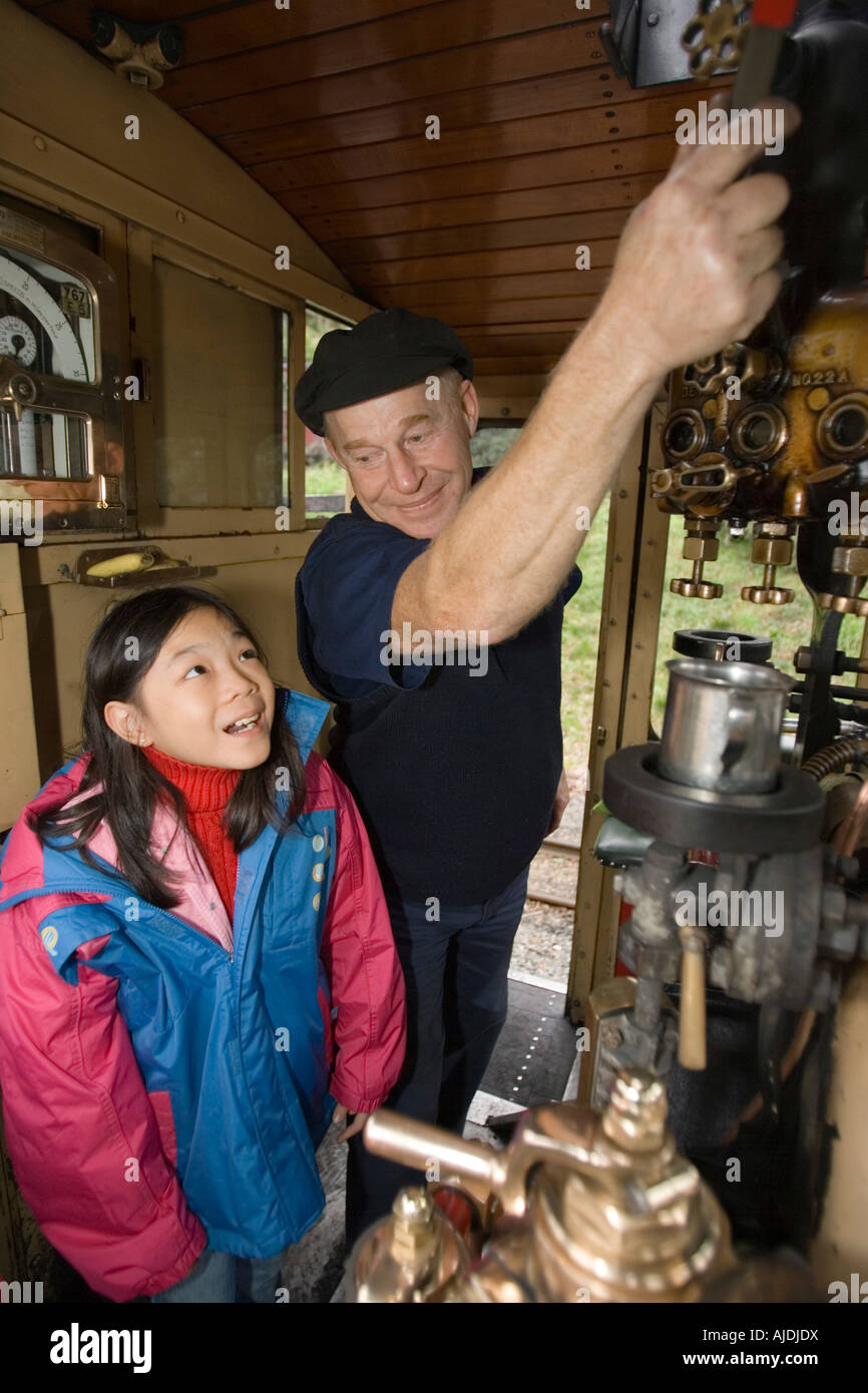 Driver demonstrates whistle to young visitor Puffing Billy historic ...