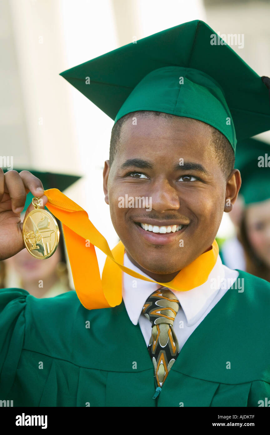 Graduate Holding Medal outside Stock Photo - Alamy