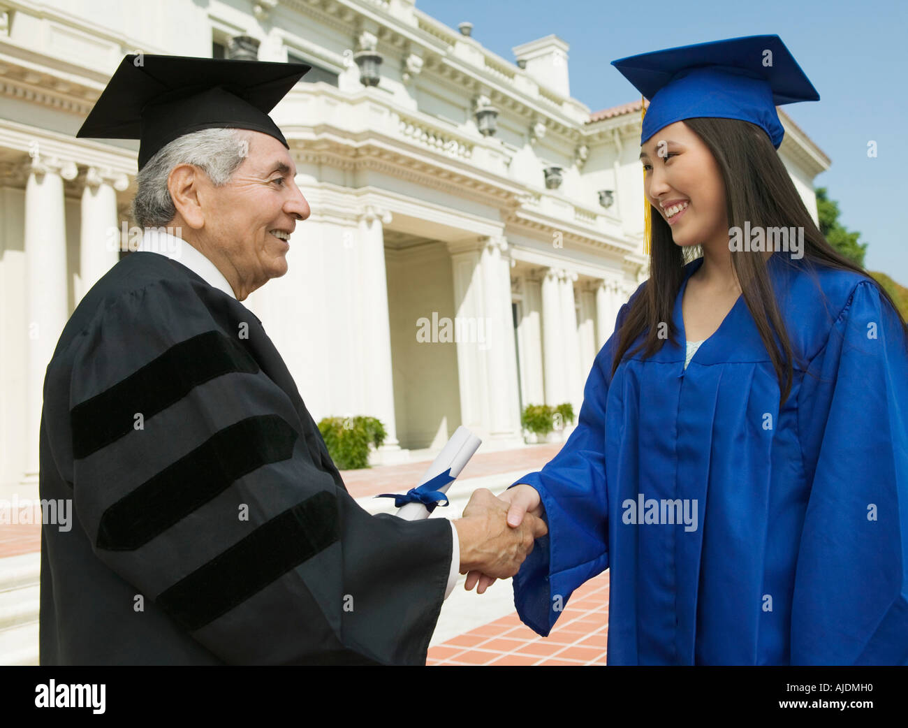 Young graduate shaking hand with dean hi-res stock photography and ...