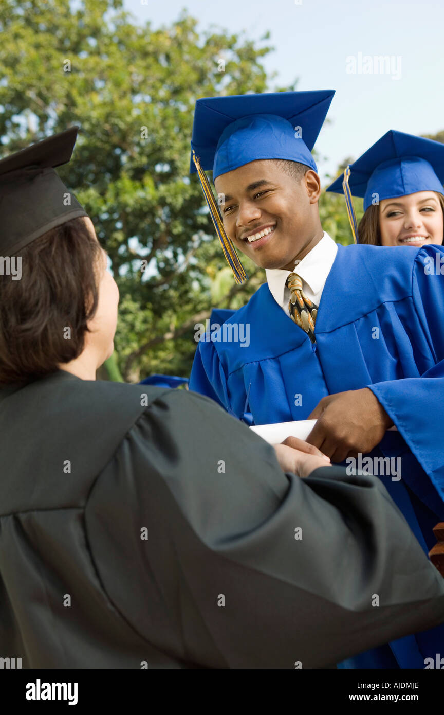 Young graduate shaking hand with dean hi-res stock photography and ...