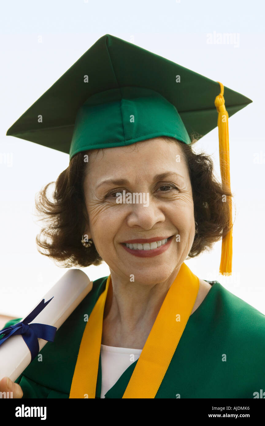 Senior graduate holding diploma outside hi-res stock photography and ...
