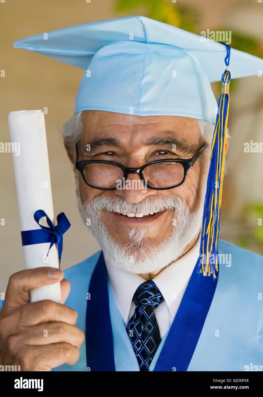 Senior graduate holding diploma outside, portrait Stock Photo - Alamy