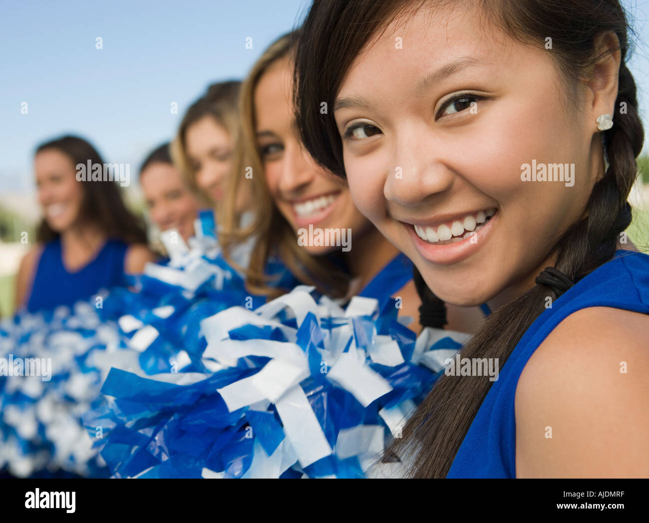 Young smiling cheerleaders posing hi-res stock photography and images ...