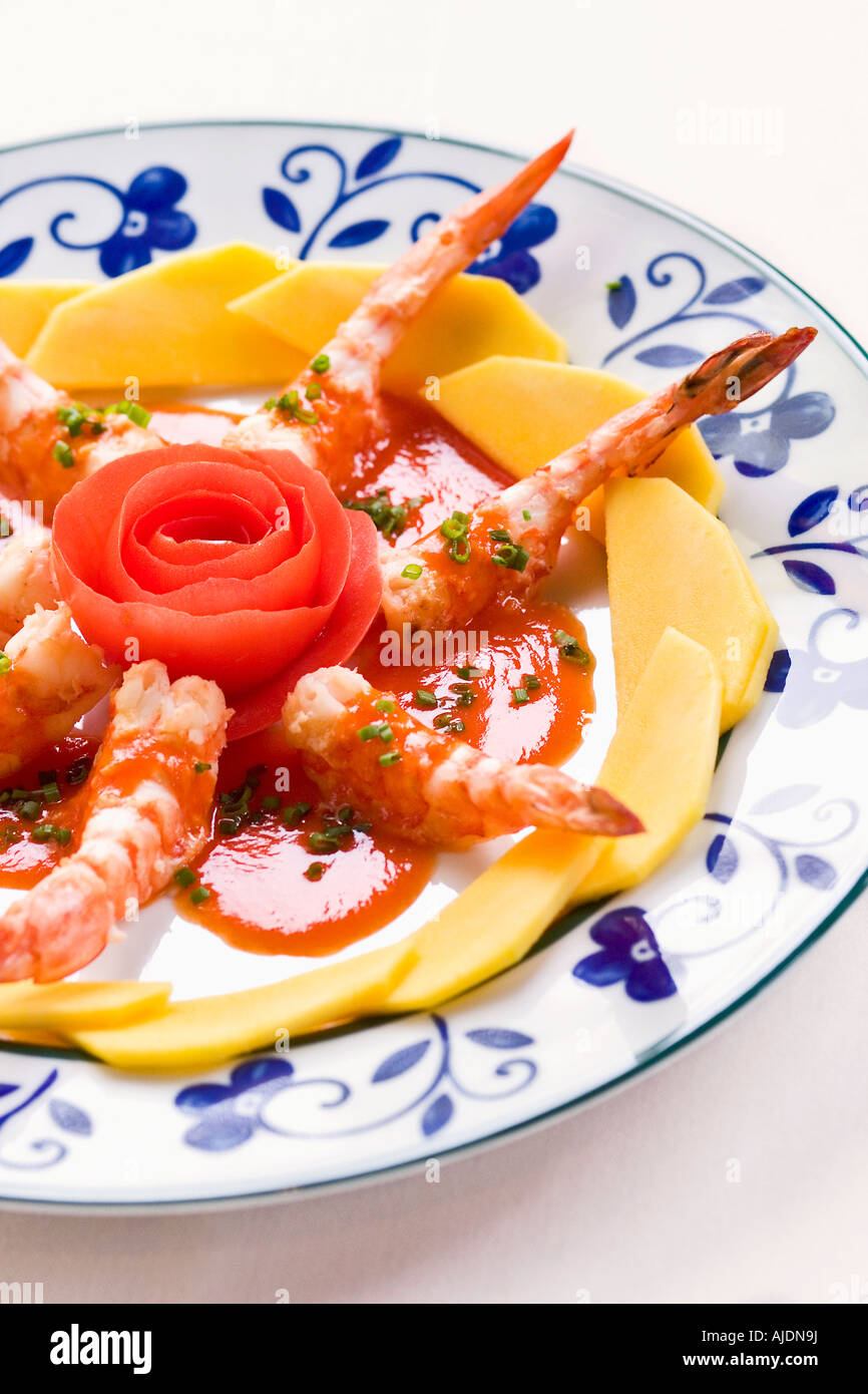 A dish of prawns with vegetables on plate Stock Photo - Alamy