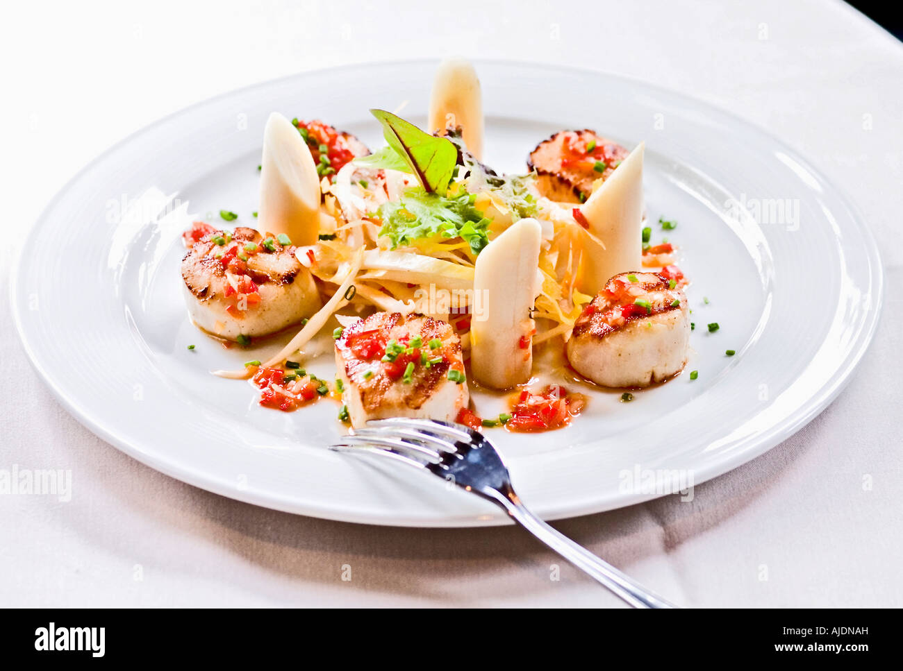 Food garnished with herbs on plate with fork Stock Photo - Alamy
