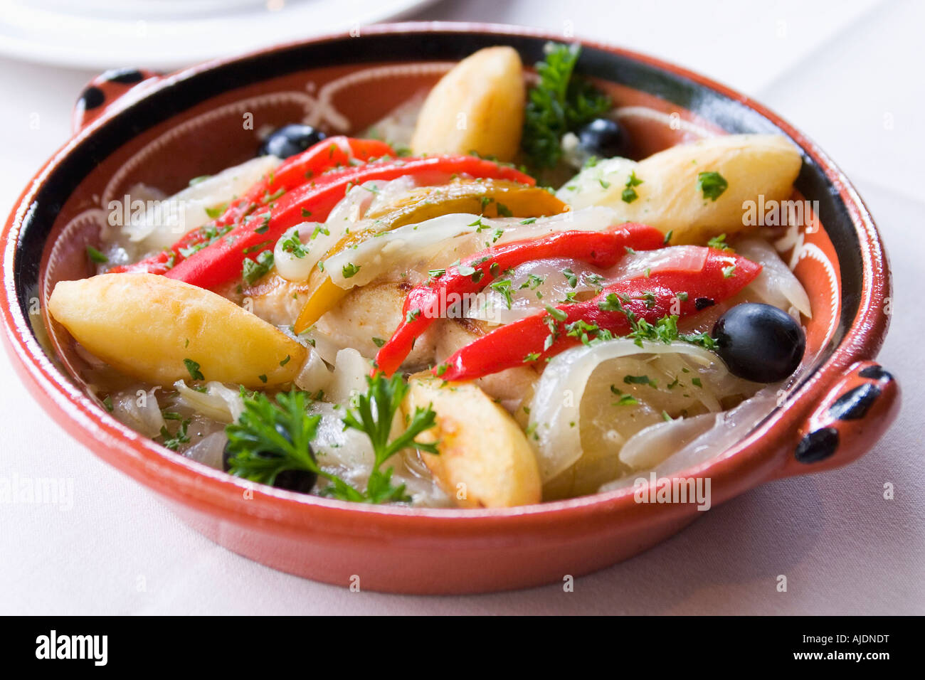 Close up of dish garnished with herbs and vegetables Stock Photo - Alamy