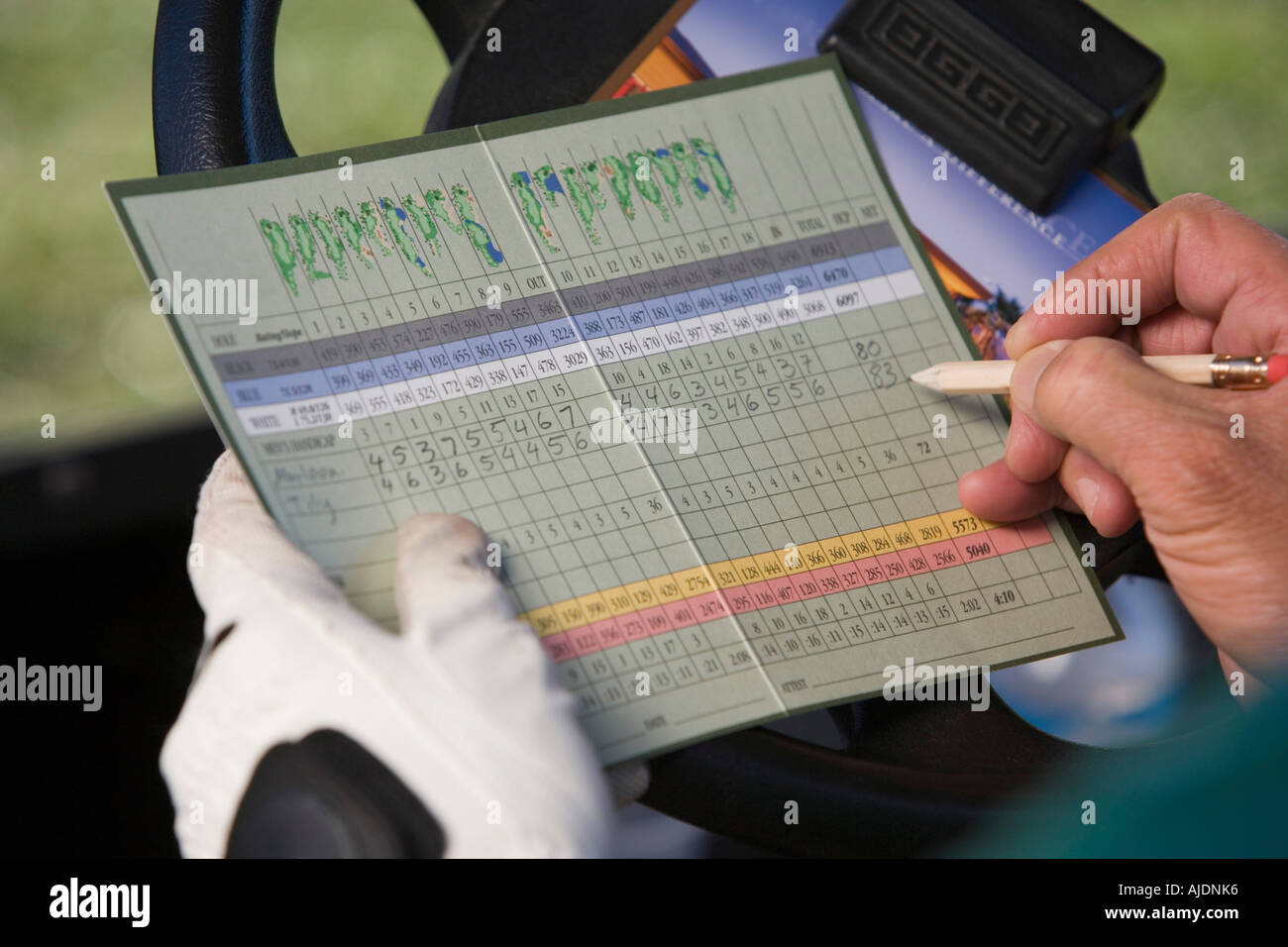 Man marking score on score card, close-up of hands Stock Photo - Alamy