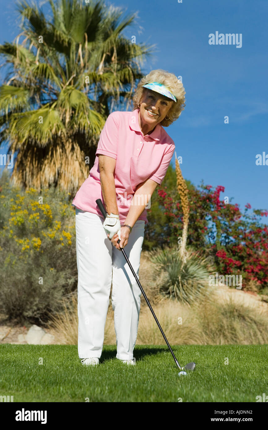 Woman playing golf, (portrait Stock Photo - Alamy