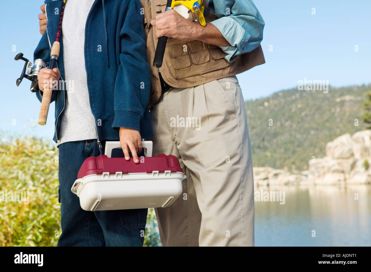 Two teenager adult fishing hi-res stock photography and images - Alamy