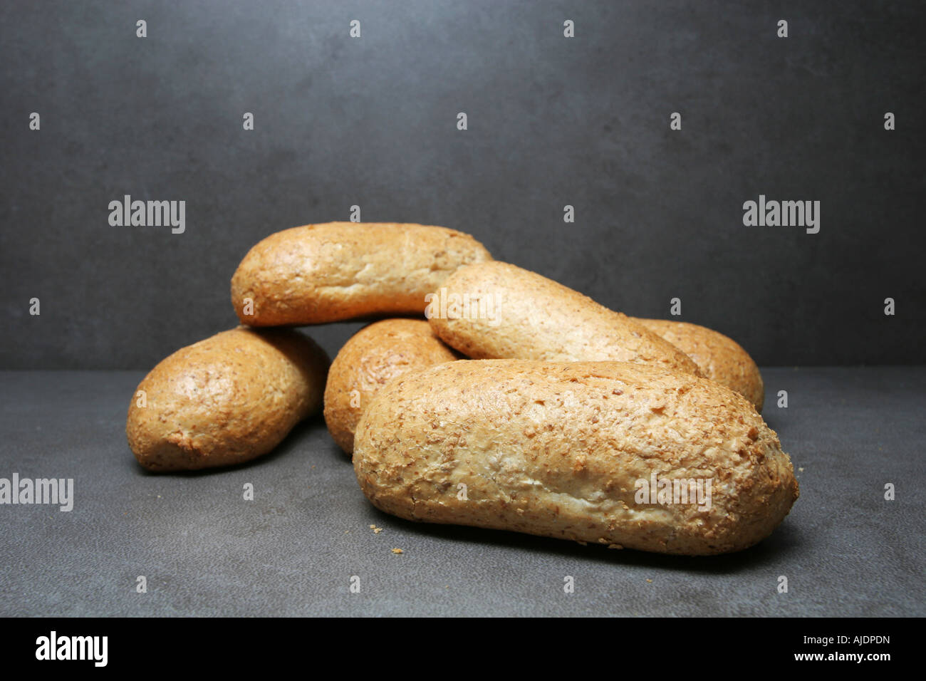 fresh bread buns on grey tiles Stock Photo - Alamy