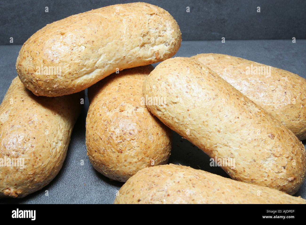 fresh bread buns on grey tiles Stock Photo - Alamy