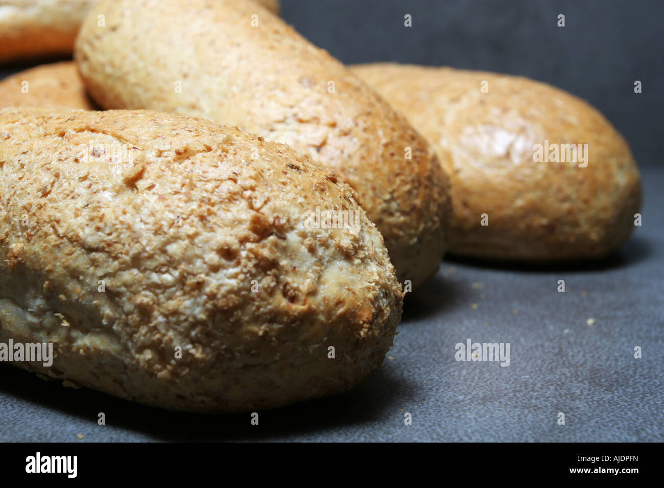 fresh bread buns on grey tiles Stock Photo - Alamy