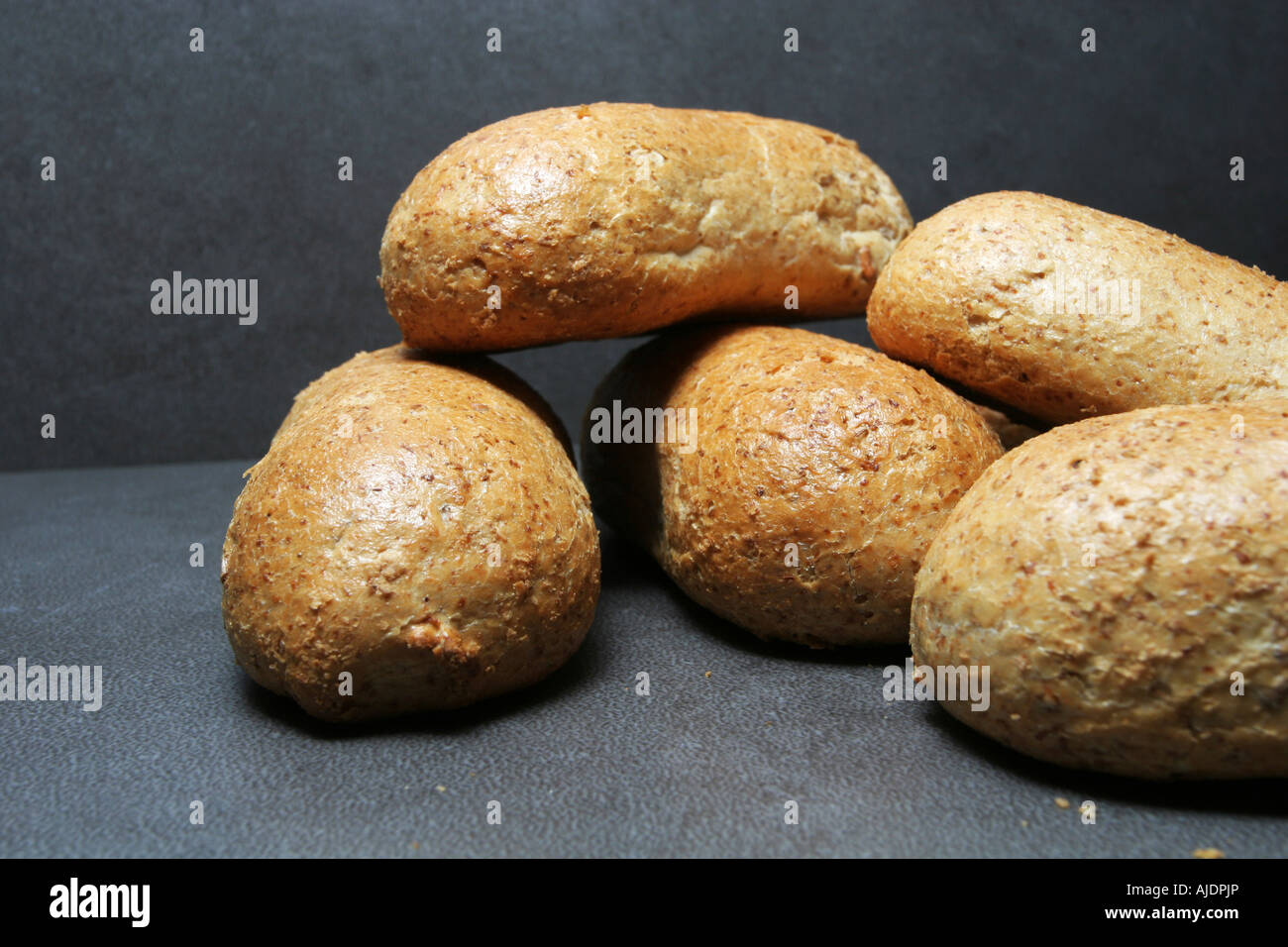 fresh bread buns on grey tiles Stock Photo - Alamy